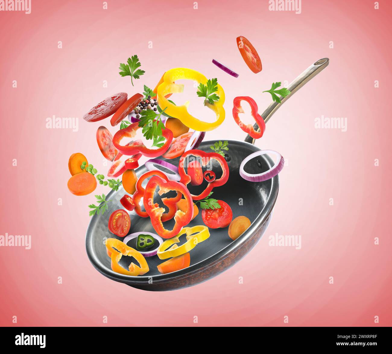 Frying pan with flying ingredients on gradient color background Stock ...