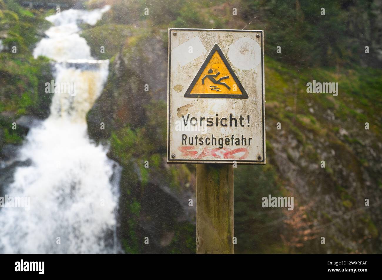 Slippery warning sign, Triberg waterfall in the Black Forest, highest ...