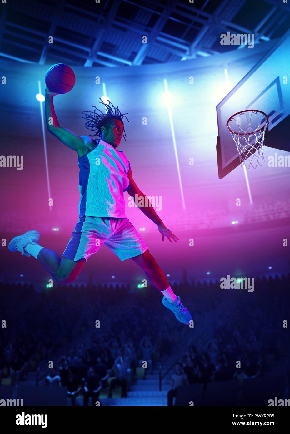Slam dunk. Competitive young man, basketball player throwing ball into ...