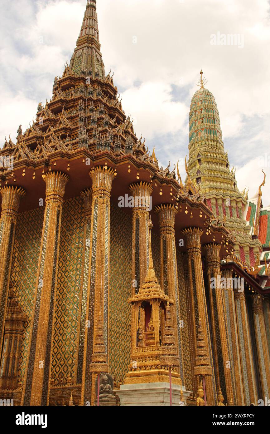A grand building adorned with ornate columns and sculptures in Bangkok ...