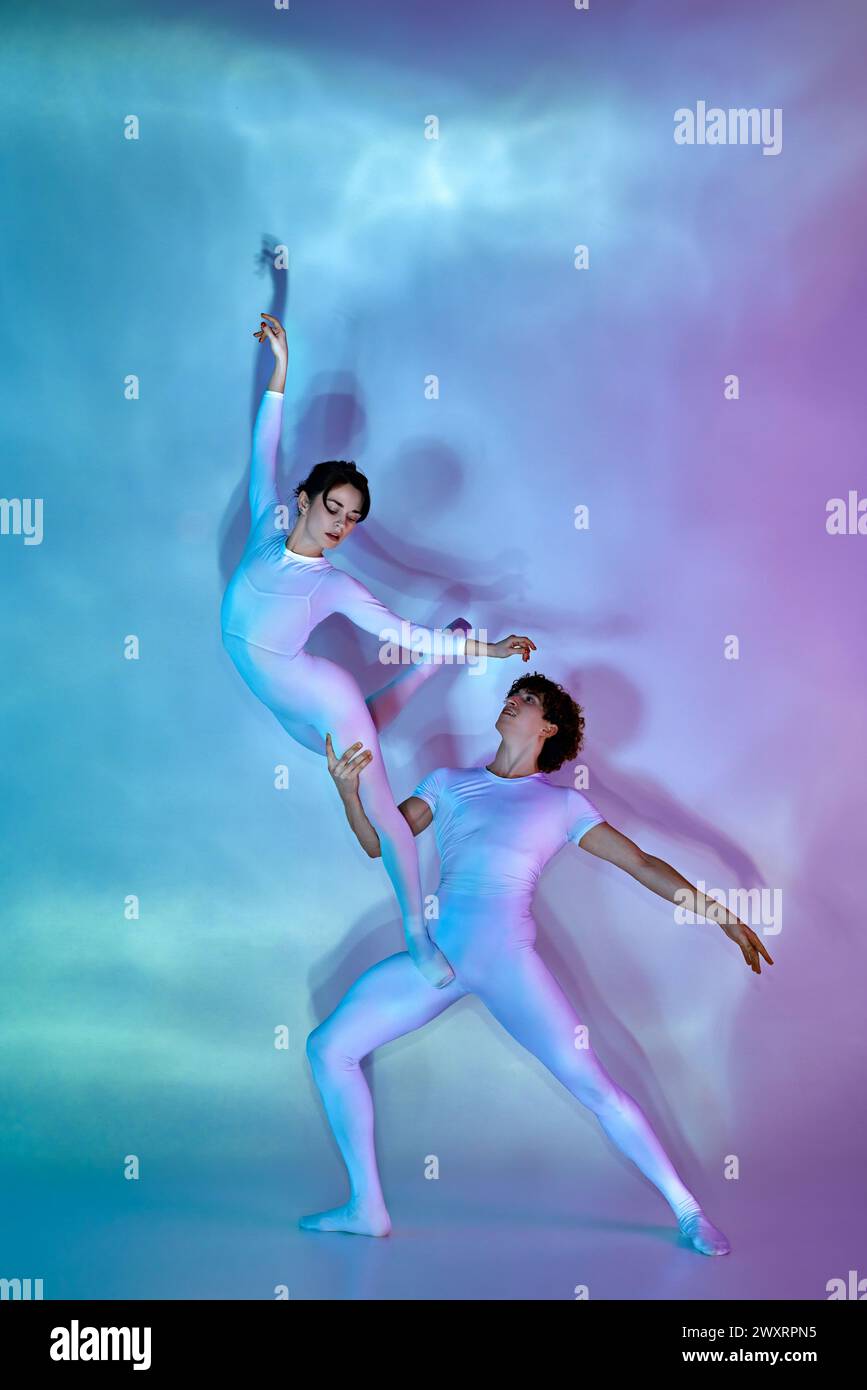 Elegant ballet pose. Two dancers intertwined in one, male dancer ...