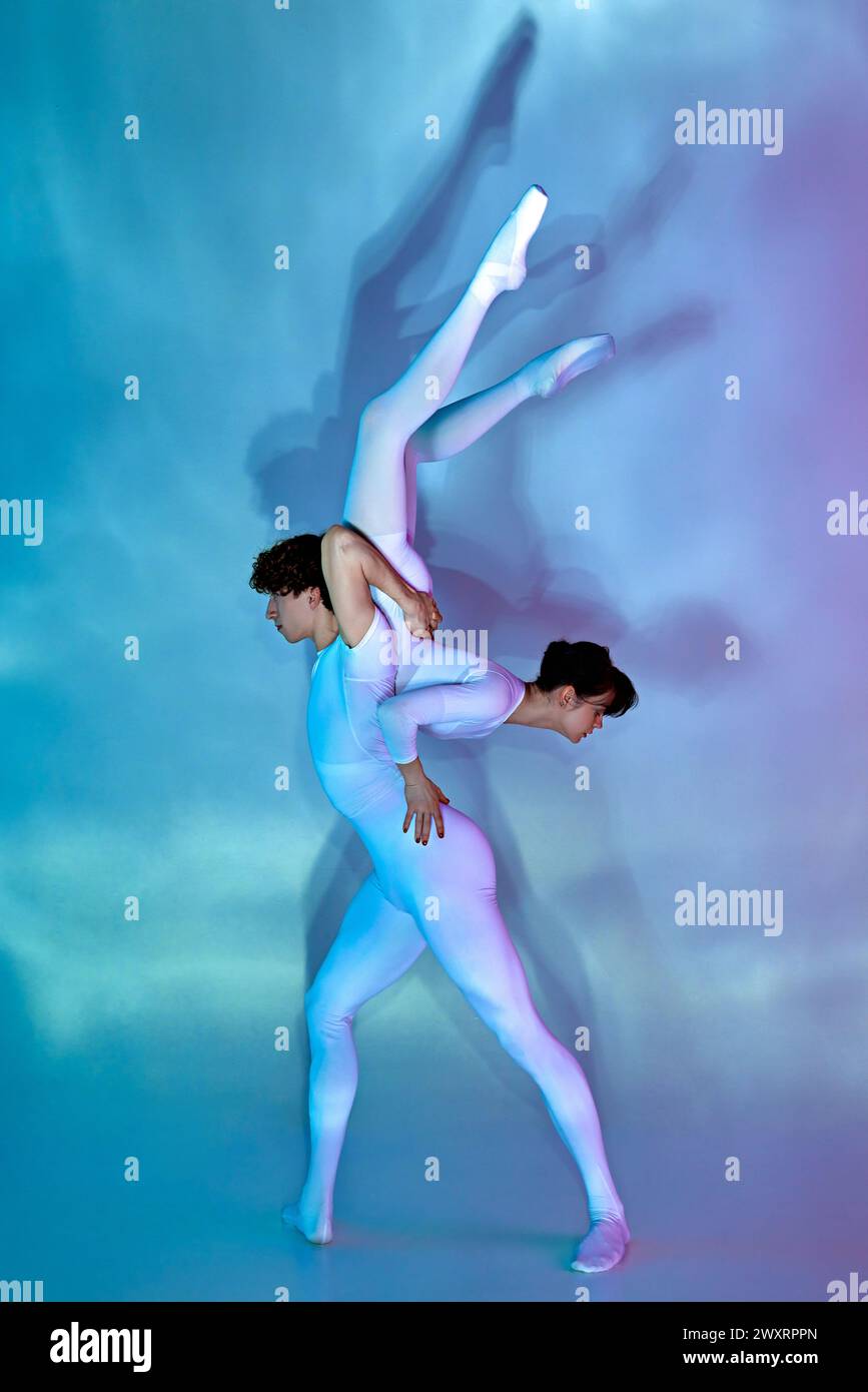 Male ballet dancer lifting his partner in a graceful dance pose ...