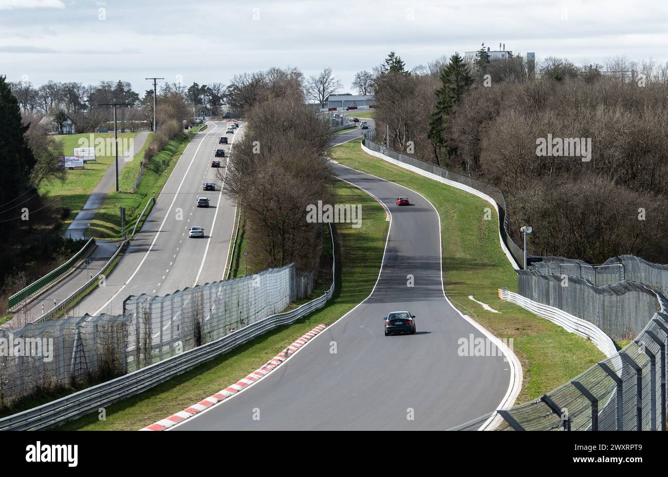 SYMBOL - 31 March 2024, Rhineland-Palatinate, Nürburg: Cars drive on ...