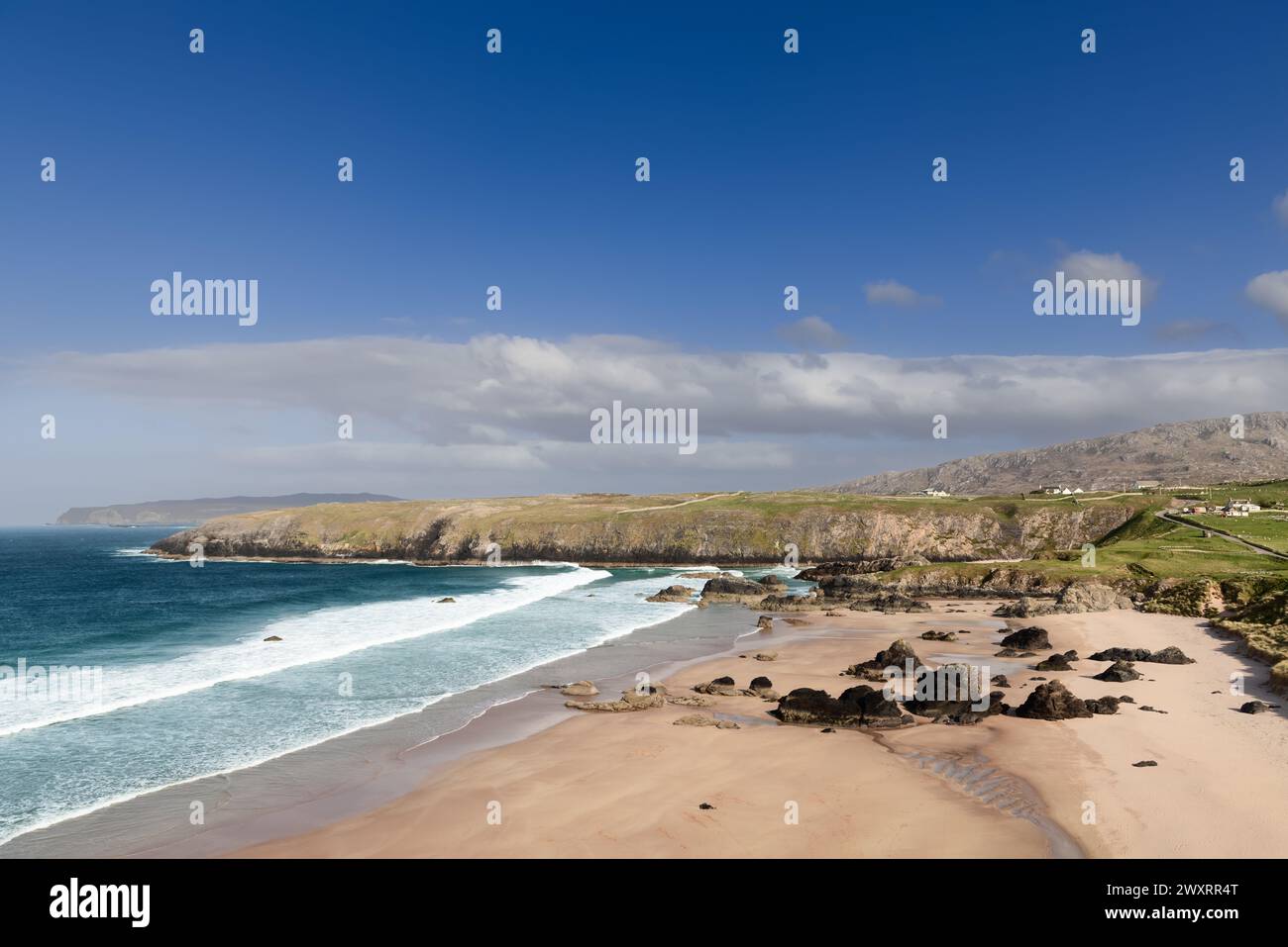 The vast expanse of Durness Beach in Scotland is depicted here, with ...
