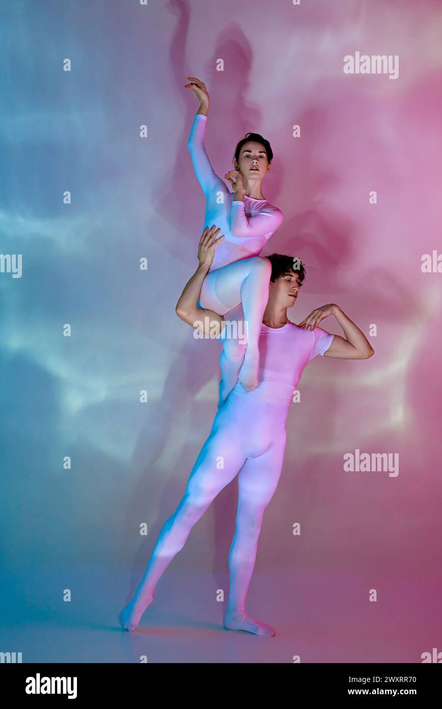 Dynamic portrait of modern male and female ballet dancers in pastel ...