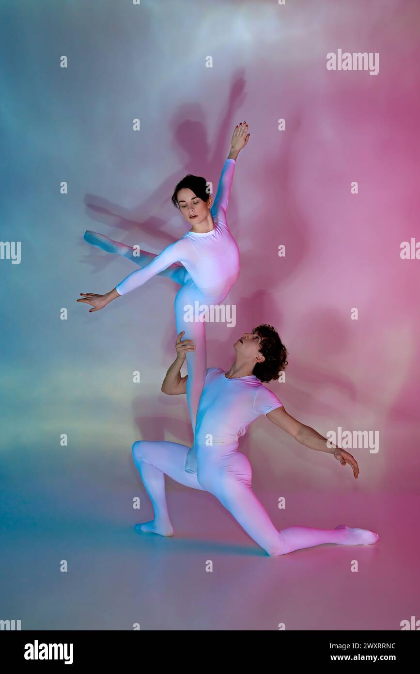 Contemporary ballet duo mid-performance, male dancer lifting female ...