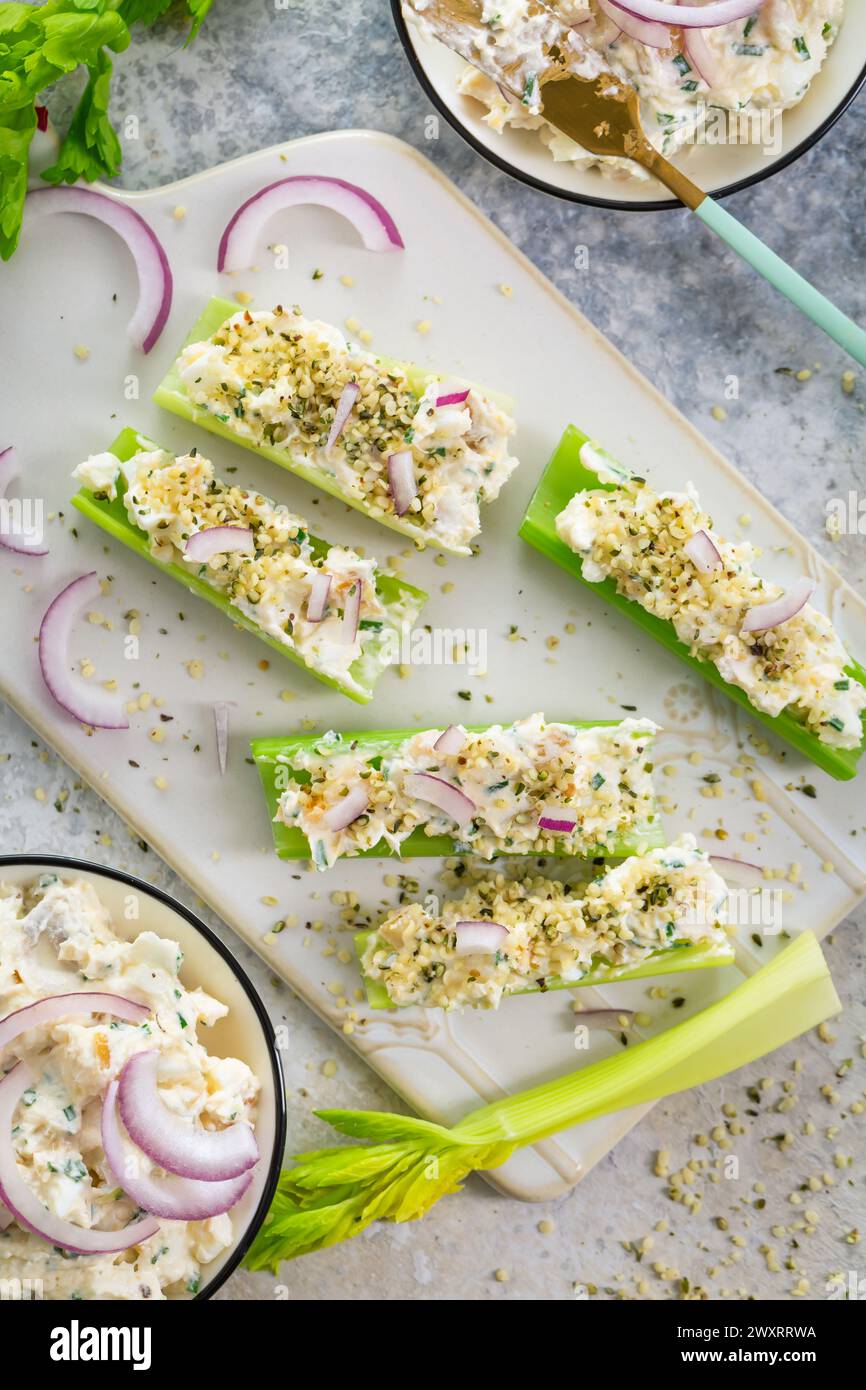 Celery sticks filled with egg and tuna salad, healthy vegetable and ...