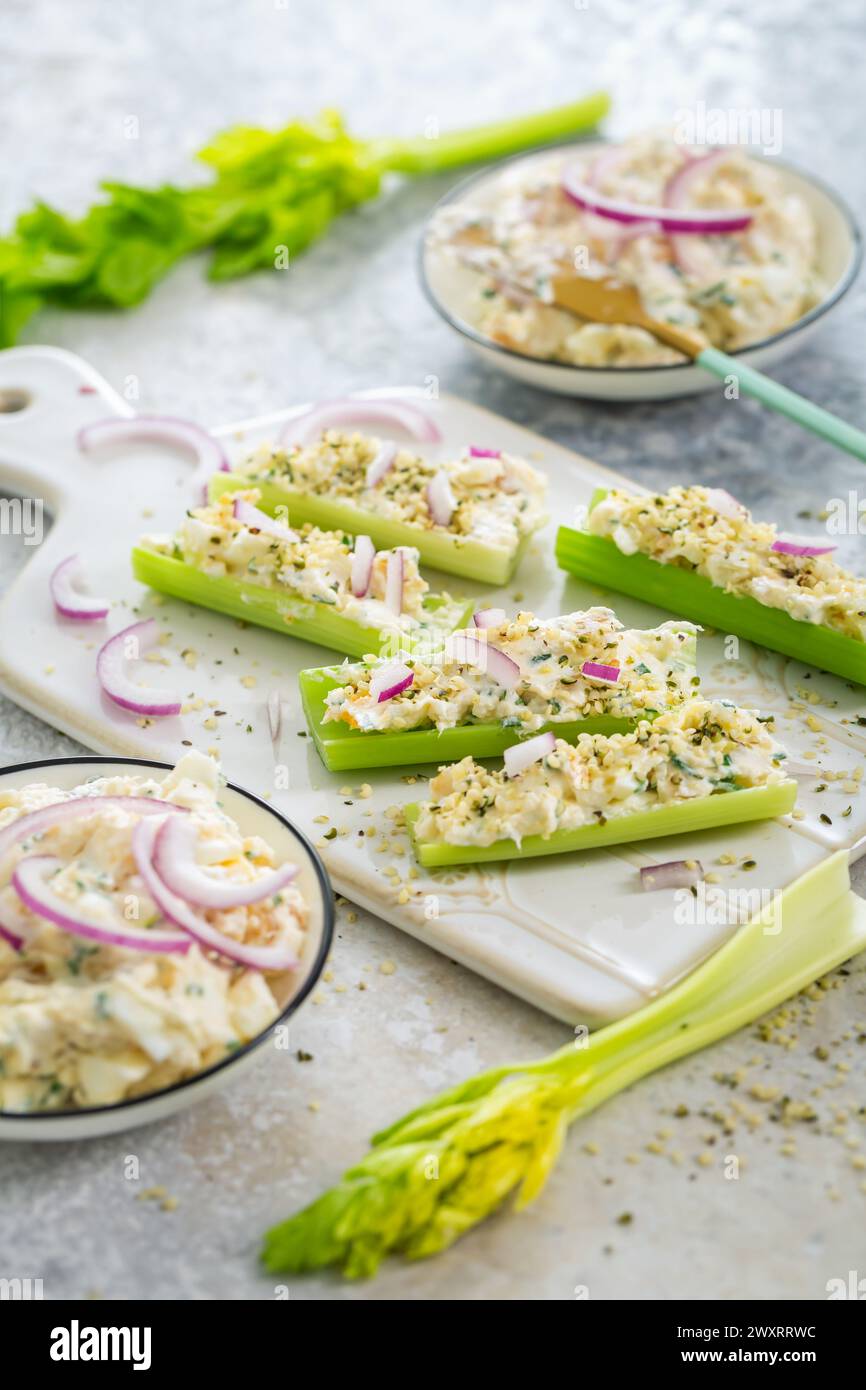 Celery sticks filled with egg and tuna salad, healthy vegetable and ...