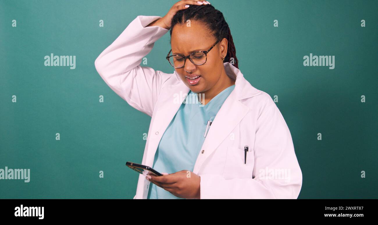 Young Black female doctor types on cellphone, receives shocking message ...