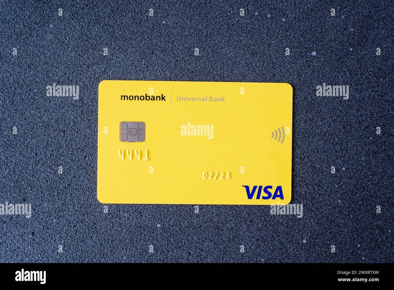 Credit card of the Ukrainian bank Monobank from Universal Bank. Yellow Visa card with chip ...