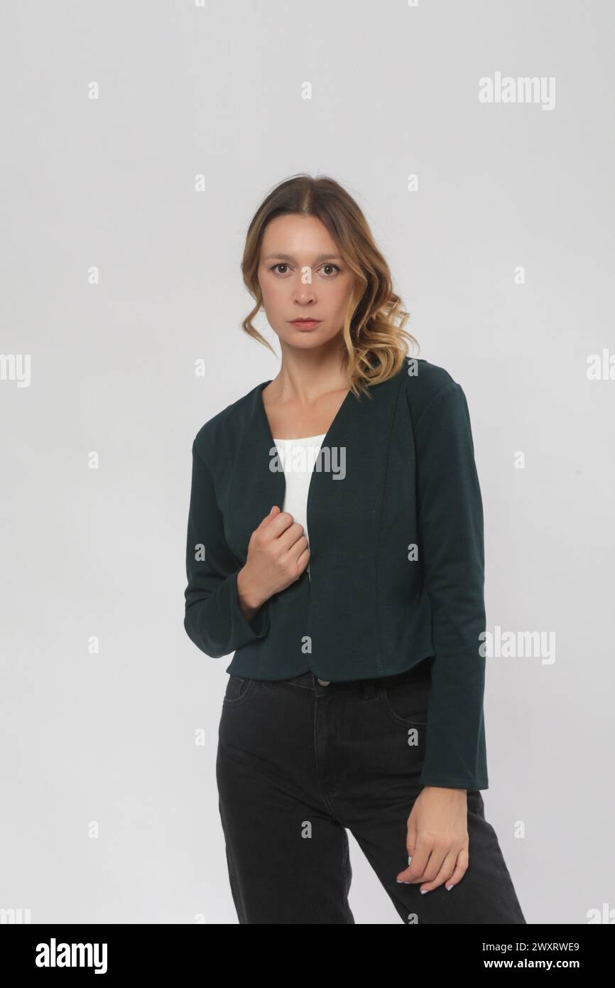 Serie of studio photos of young female model wearing comfortable basic ...