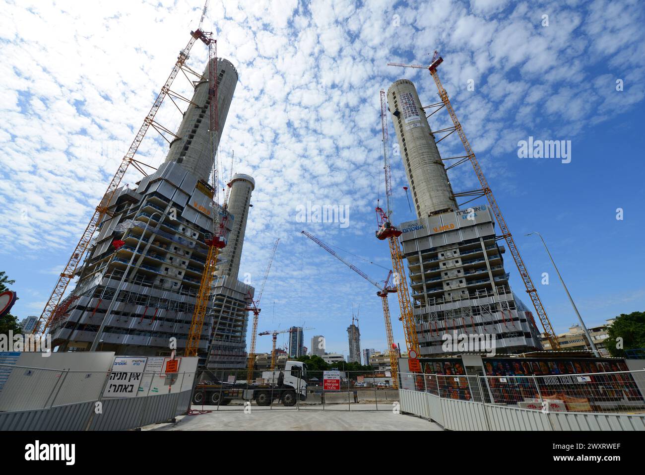A modern urban complex with three towers under construction in Kikar ...