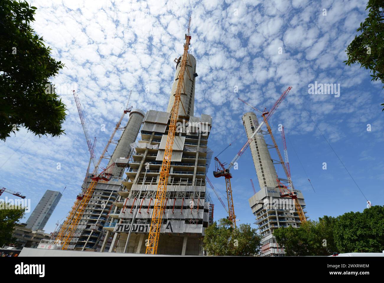 A modern urban complex with three towers under construction in Kikar ...
