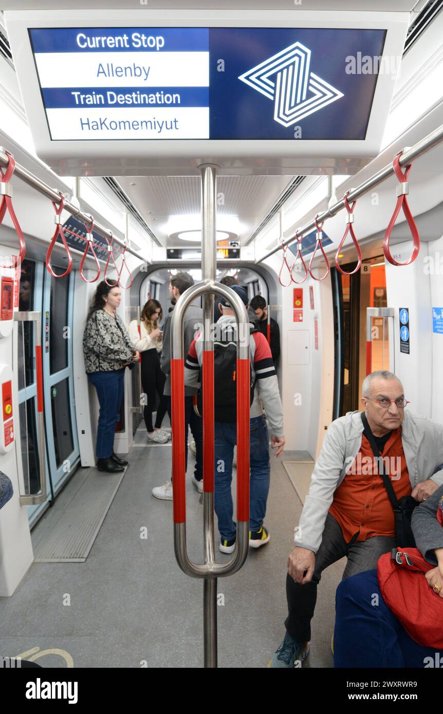 Passengers riding on the modern light railway train in Tel-Aviv, Israel ...