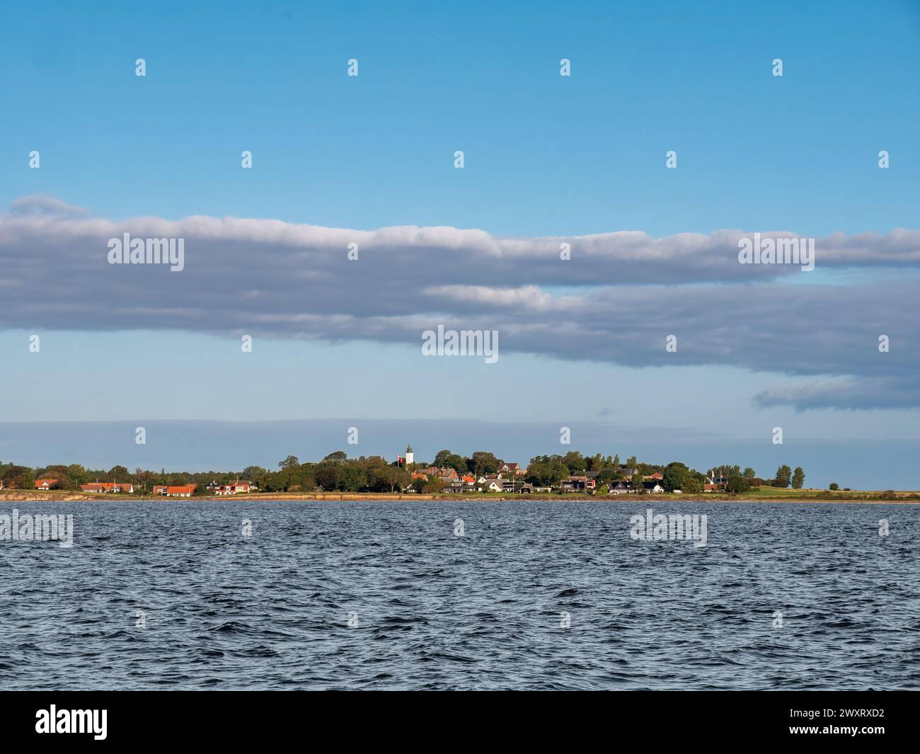 Coastline of Tunø By town with church-lighthouse on Tunø island ...