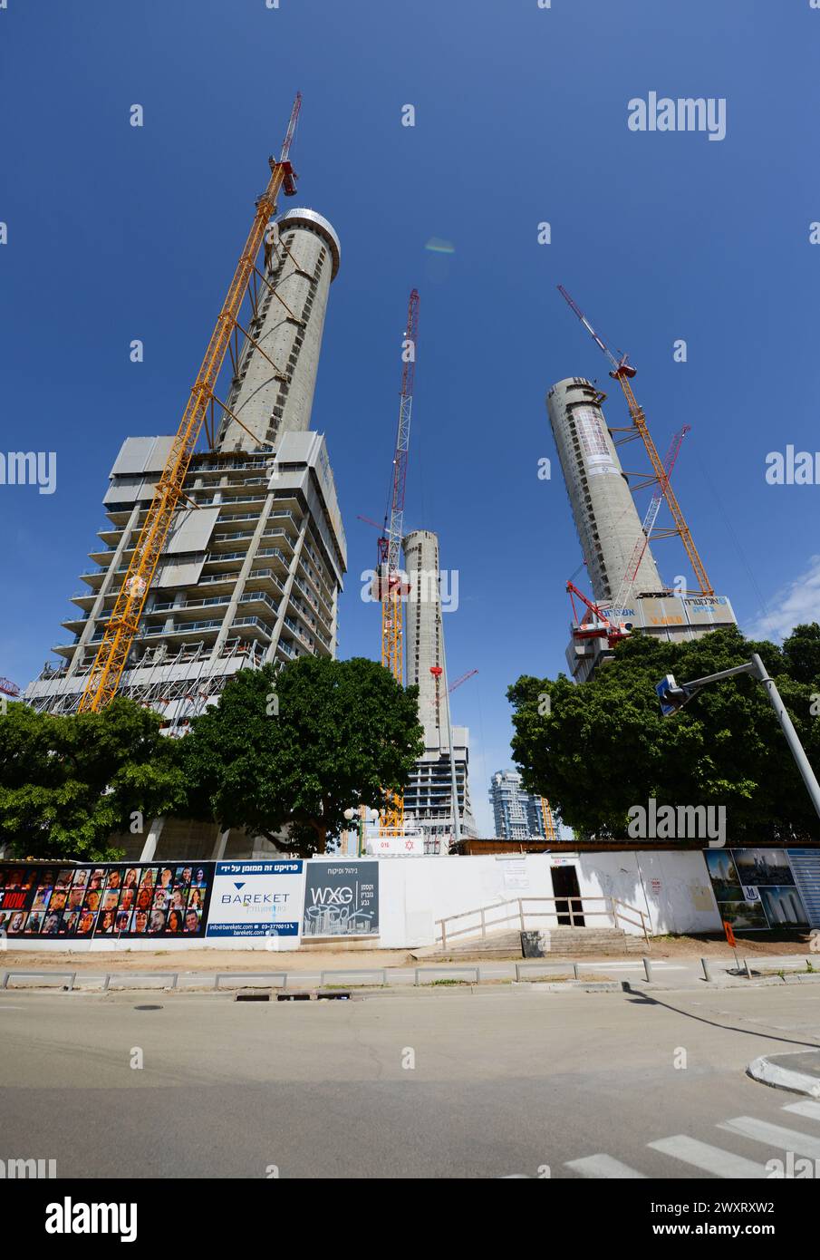 A modern urban complex with three towers under construction in Kikar ...