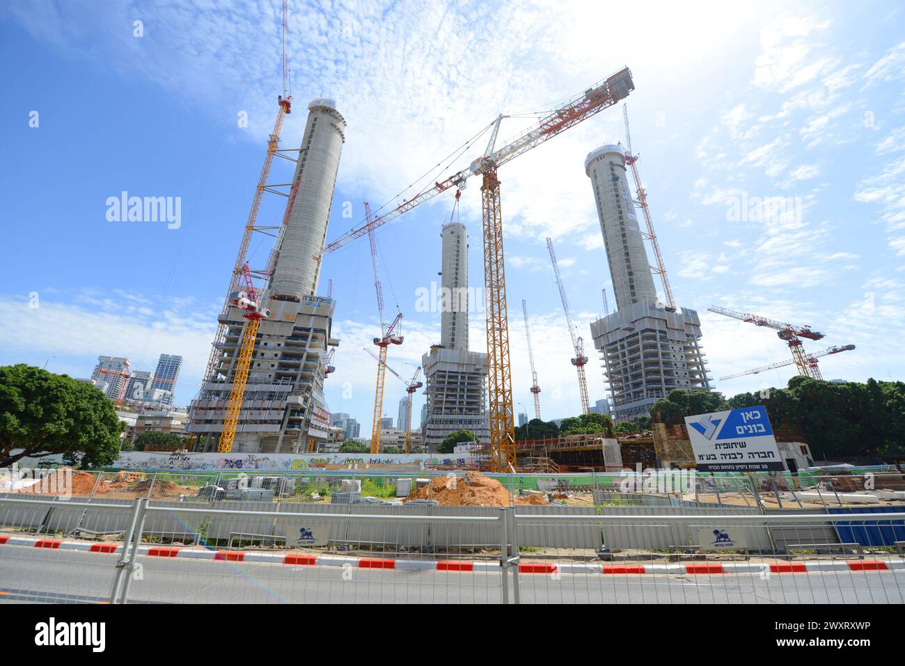 A modern urban complex with three towers under construction in Kikar ...