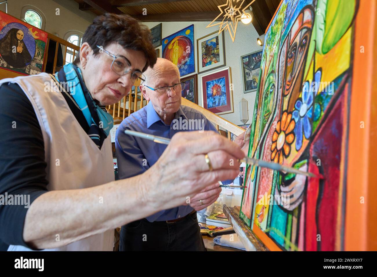 Wassenach, Germany. 21st Mar, 2024. Beate and Ulrich Heinen paint a ...
