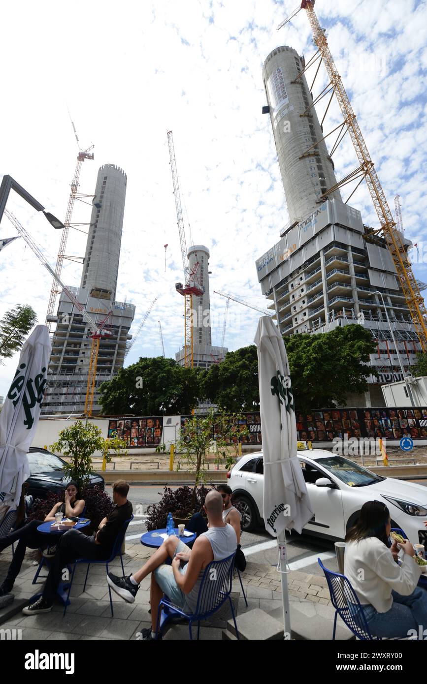 A modern urban complex with three towers under construction in Kikar ...