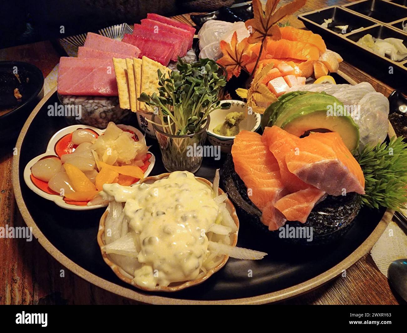 Sashimi consisting of several types of fish, including salmon and tuna ...
