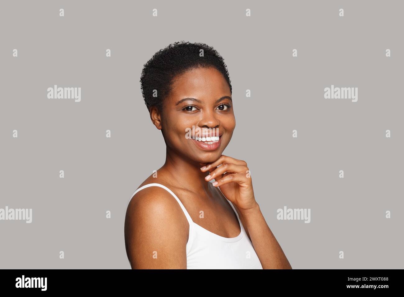 Nice healthy lady with dark clean fresh skin on white background ...