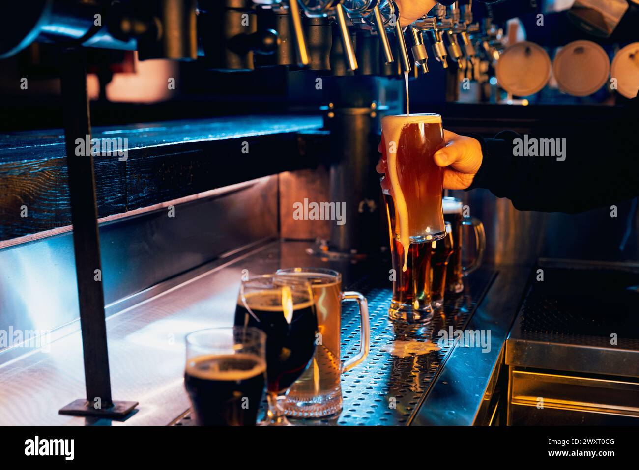 Filling glass frothy beer in hi-res stock photography and images - Alamy