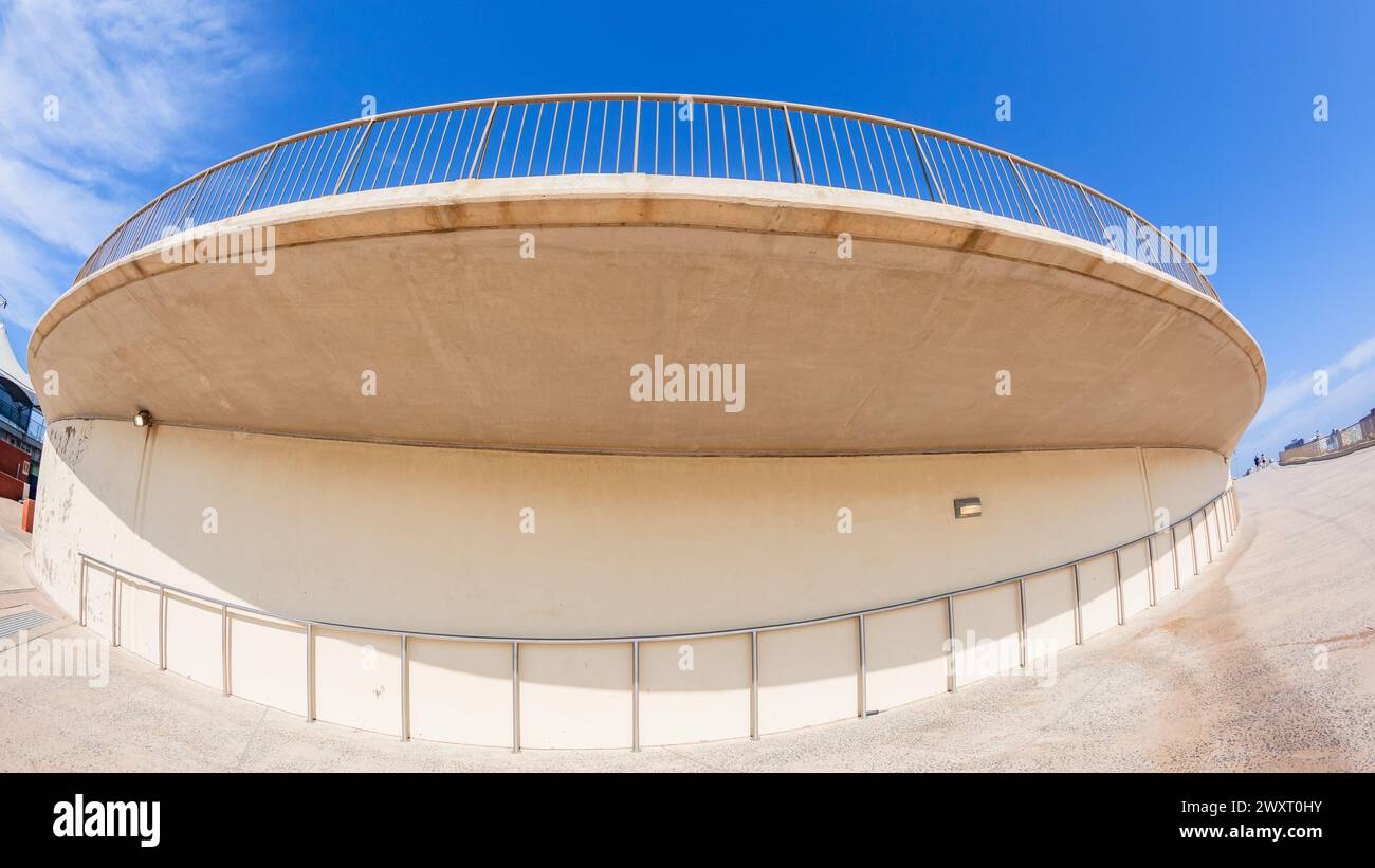 High concrete wall structure with steel fence railing for public safety ...