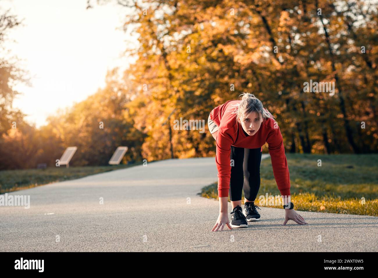 Woman runner before jogging in hi-res stock photography and images - Alamy