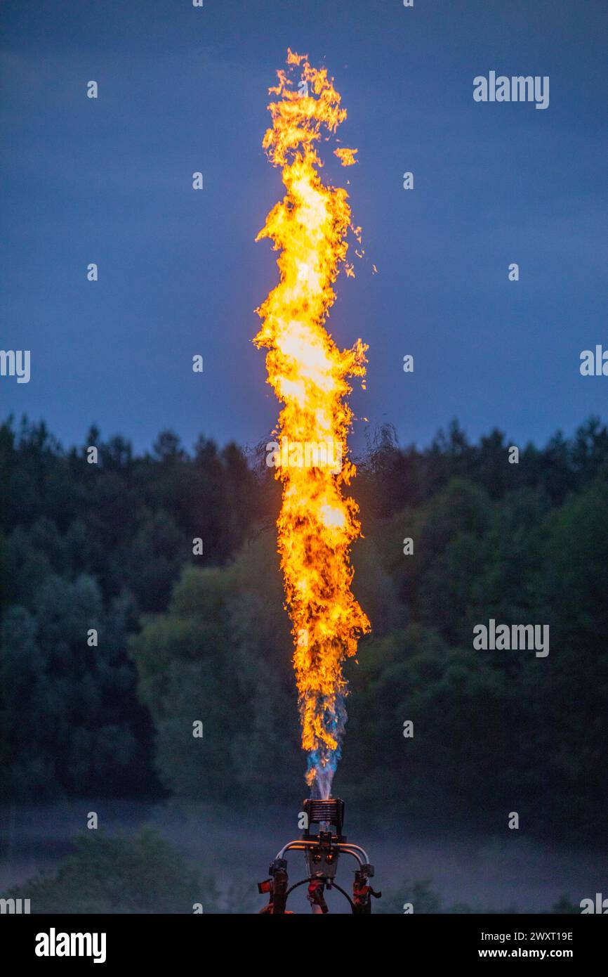 Sunset Glow: Gas Burner Fire Casts a Warm Hue on the Evening Sky Stock ...
