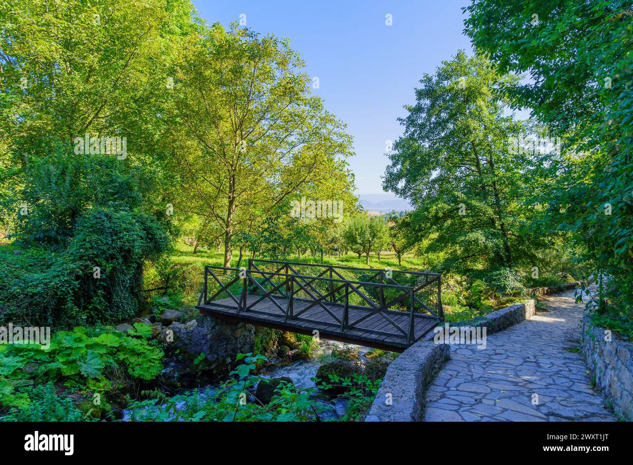 View of a footpath along the Vevchani springs, the village of Vevchani ...