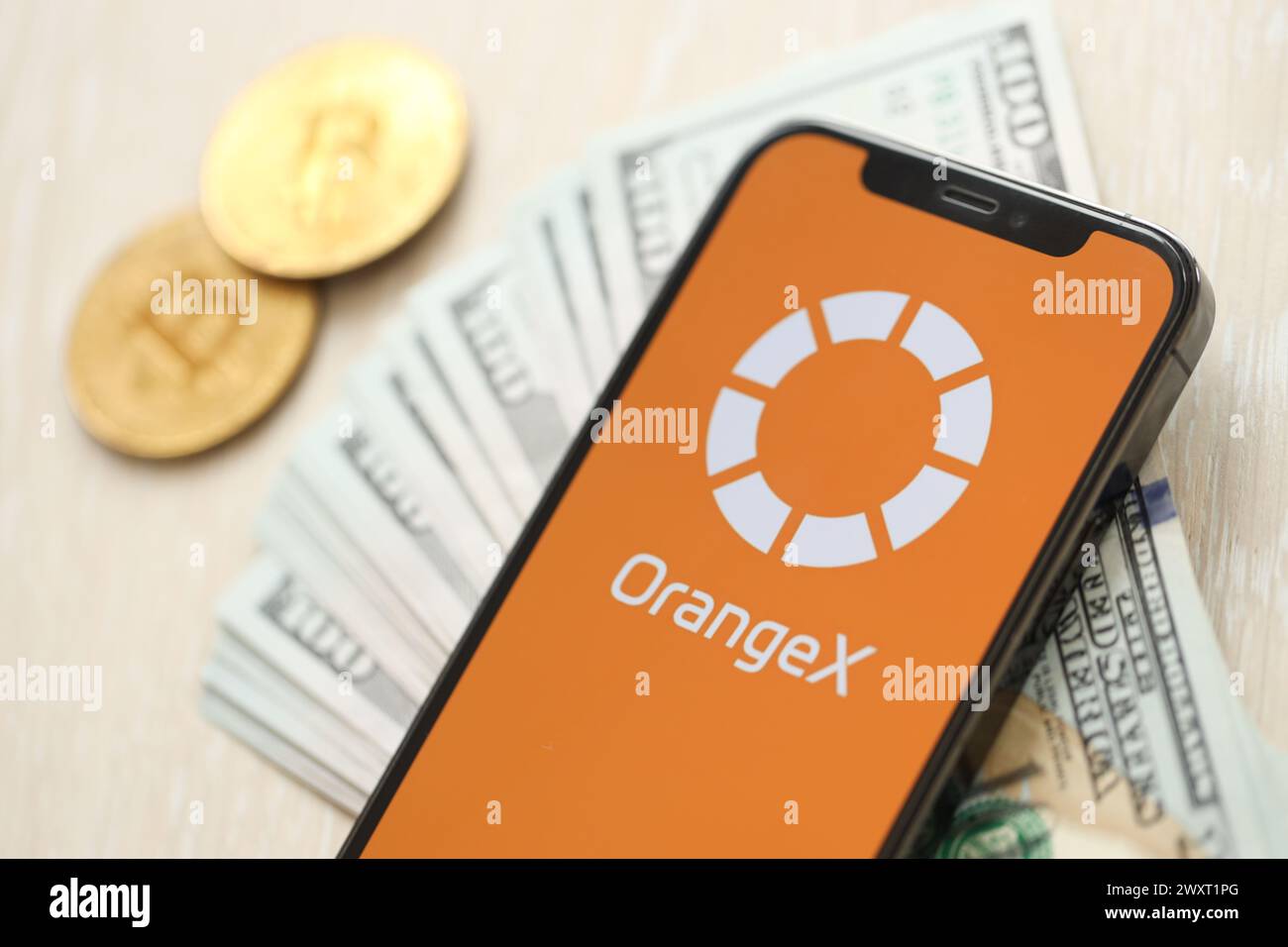 KYIV, UKRAINE - MARCH 15, 2024 OrangeX logo on iPhone display screen ...