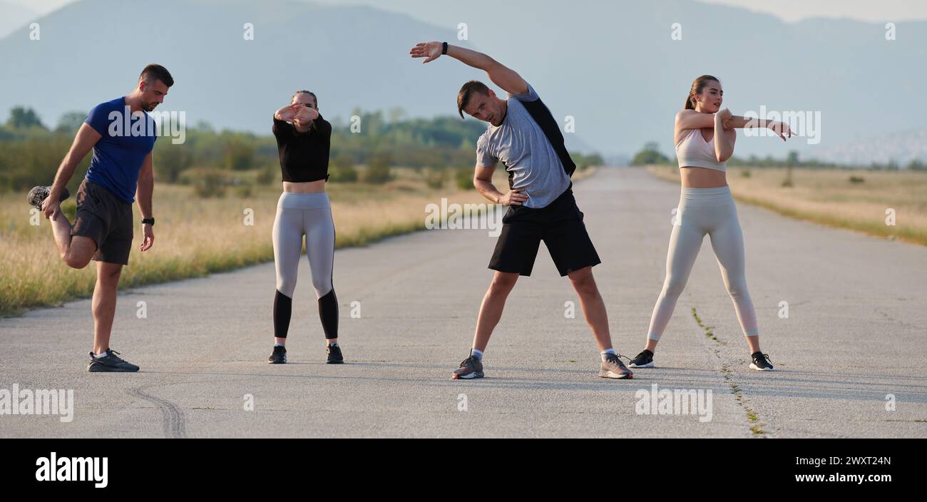 Diverse Group of Athletes Prepare Together for a Run Stock Photo - Alamy