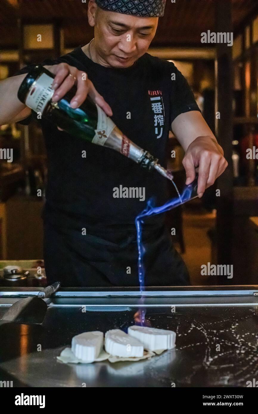 Berlin, Germany 08. 16. 2023. Teppanyaki chef cooking at teppan in a ...