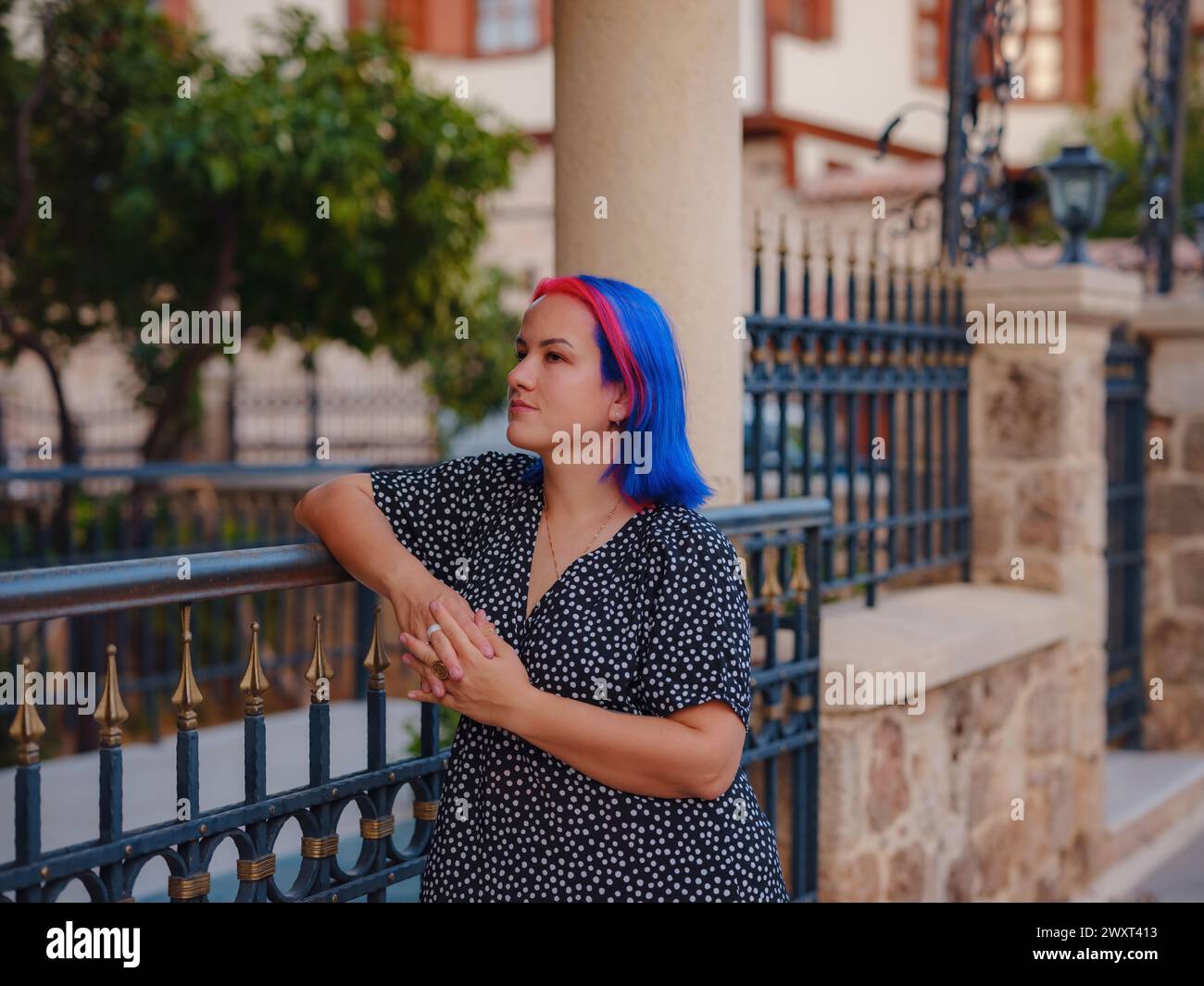 female summer old town walk in Antalya Turkey. woman with colorful hair ...