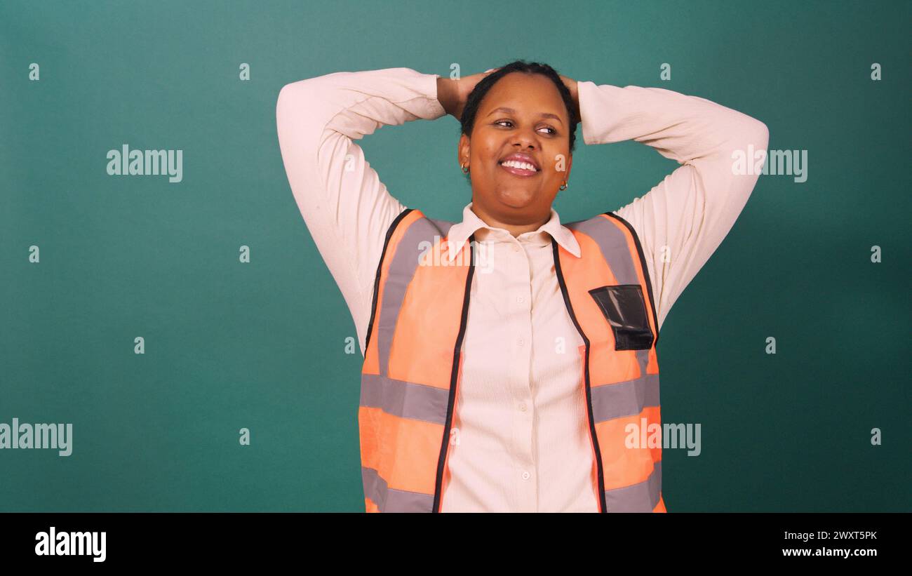 Relaxed young project manager takes a break construction site, arms ...