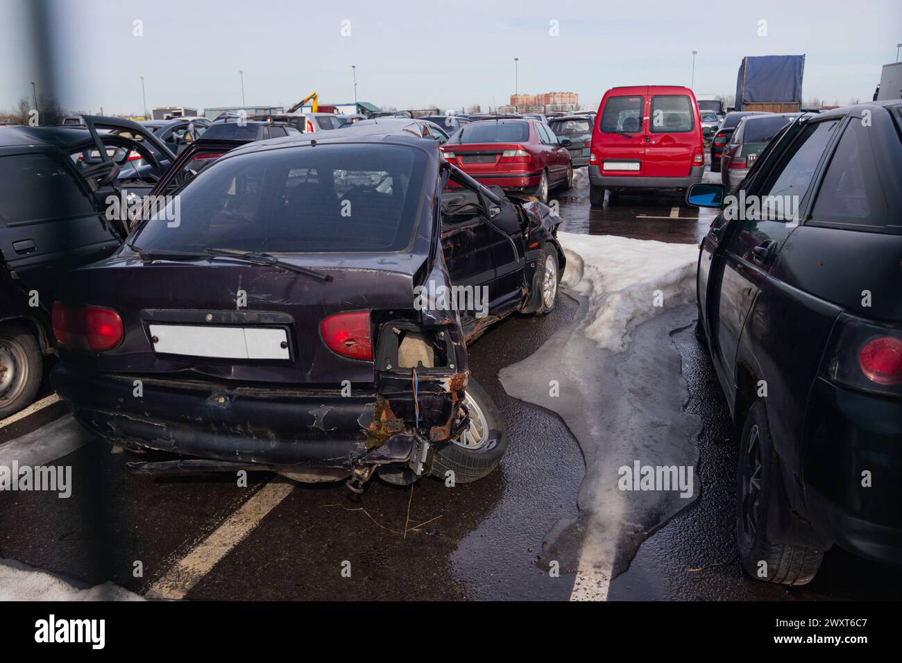 Broken and burnt cars after road accidents stand in a special parking ...