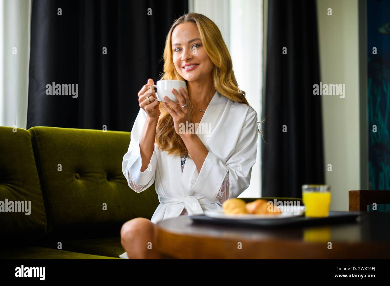 Young woman relaxes on cozy hi-res stock photography and images - Alamy