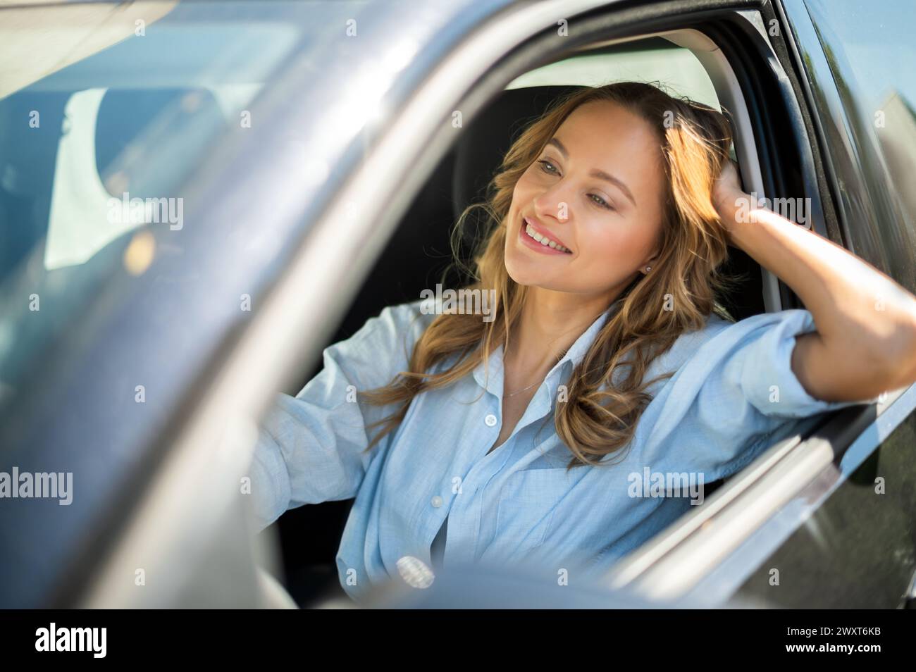 Young lady driving her car Stock Photo - Alamy