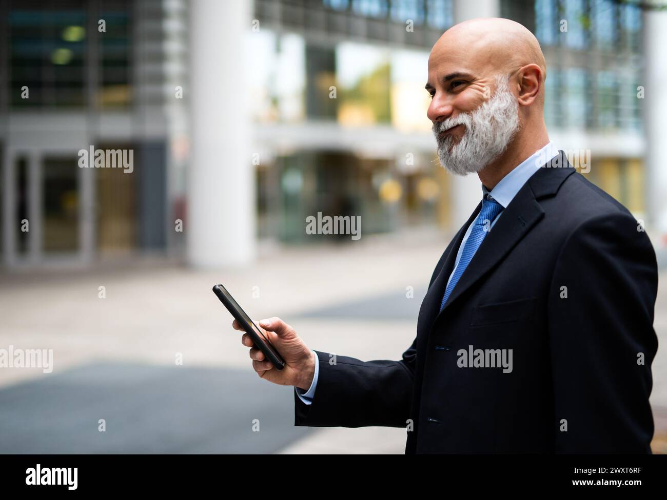 Handsome bald businessman using hi-res stock photography and images - Alamy
