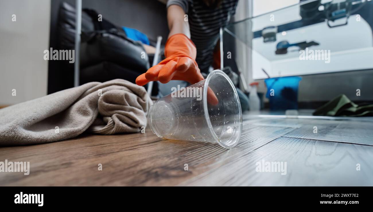 Woman cleaning up party hi-res stock photography and images - Alamy