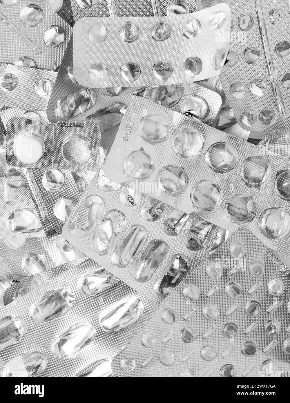 A pile of used silver blisters. Empty pill blister packs. Medicine ...