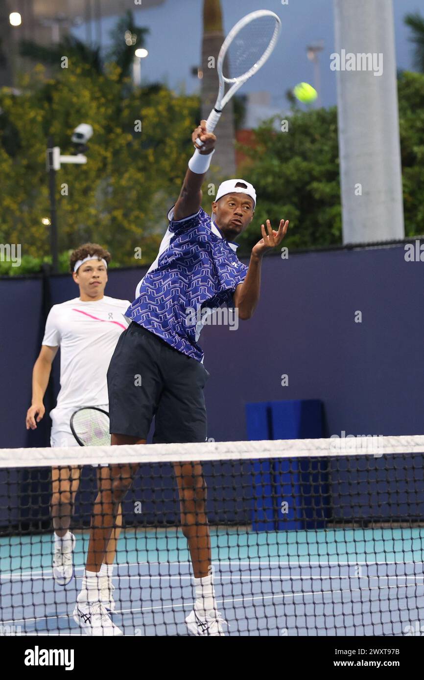 Christopher Eubanks hits an overhead smash at the Miami Open on March ...