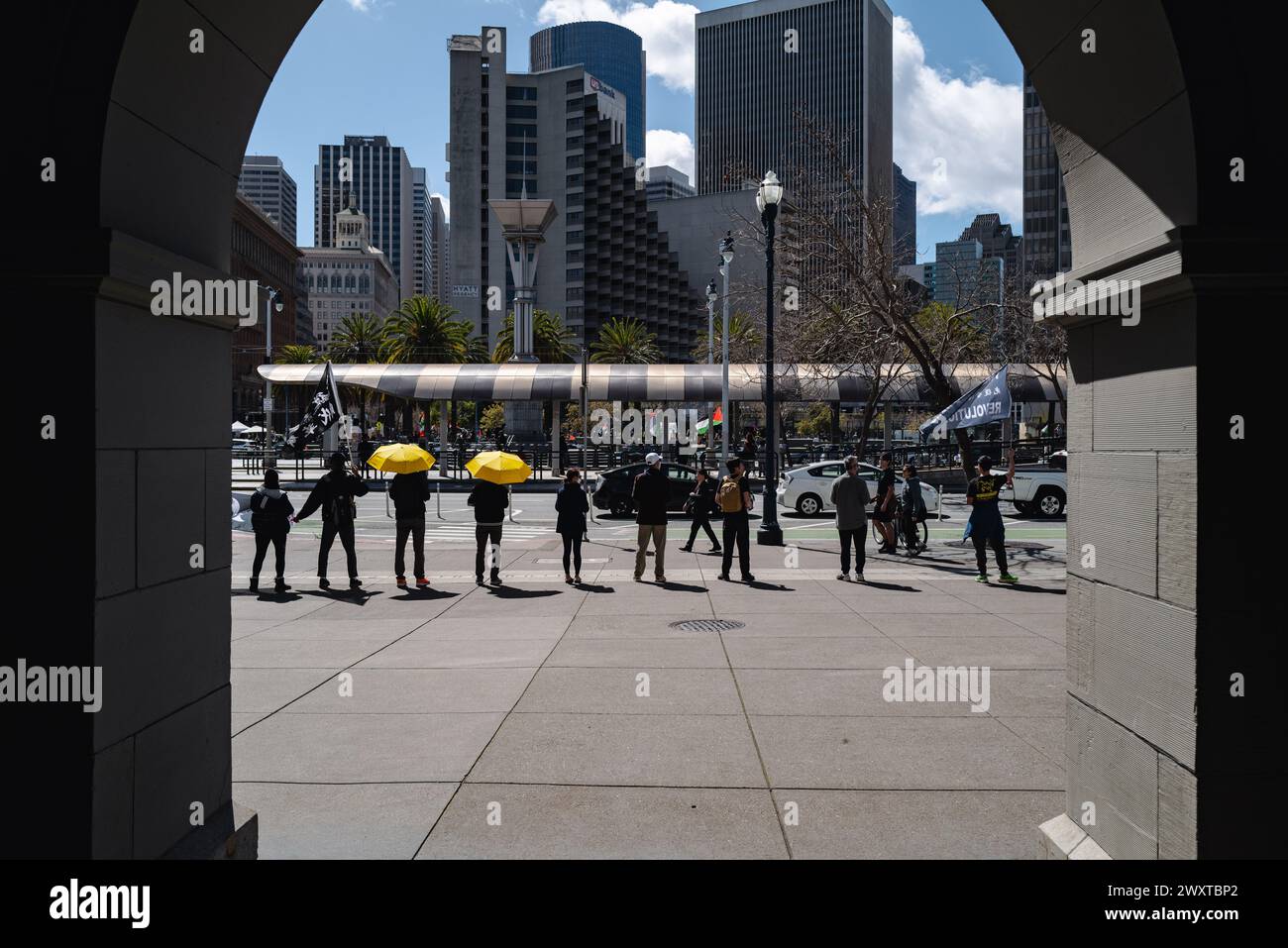 Protesters link arms in solidarity, forming a human chain that ...