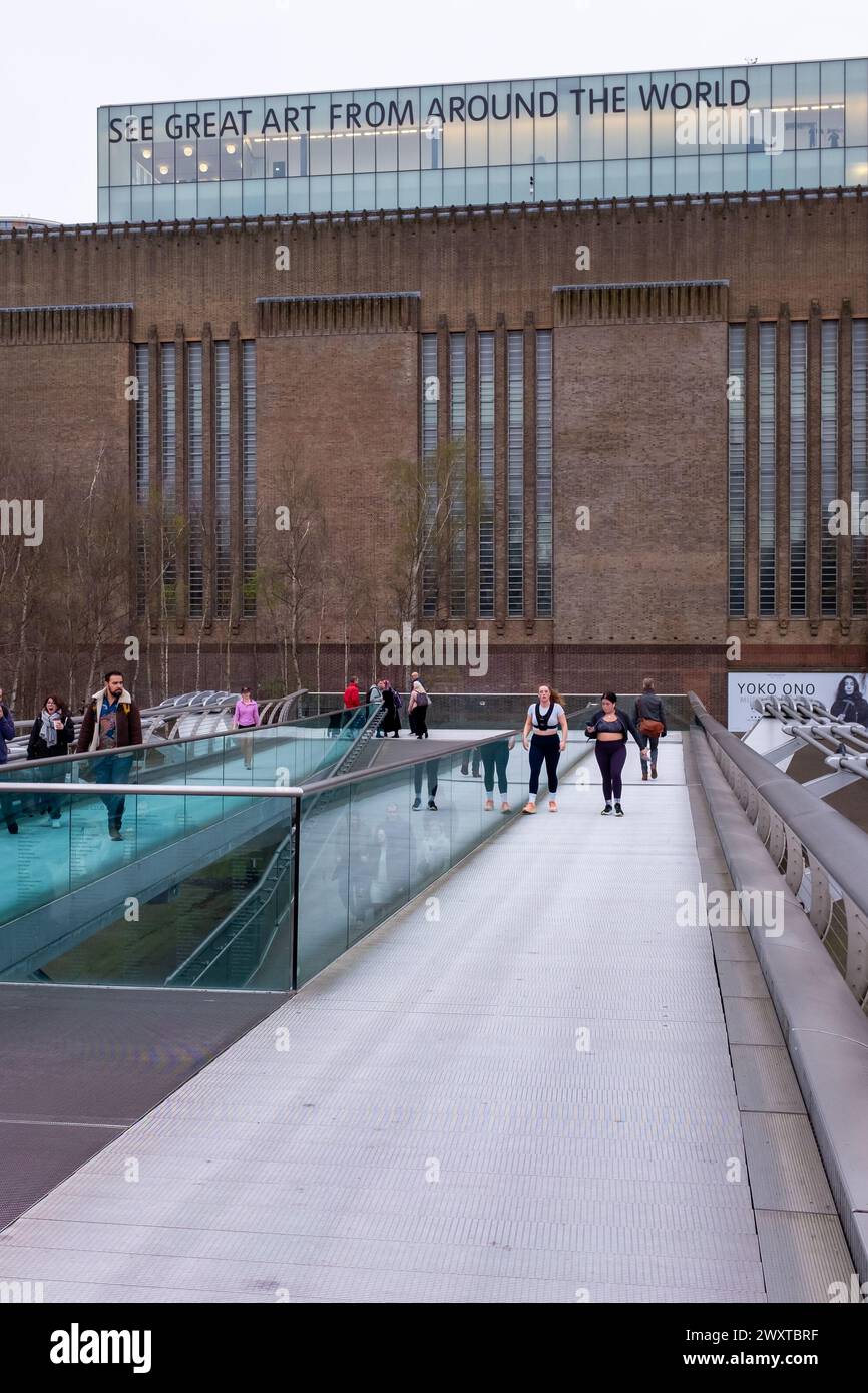 People on the Millennium Bridge in front of the Tate Modern gallery on ...