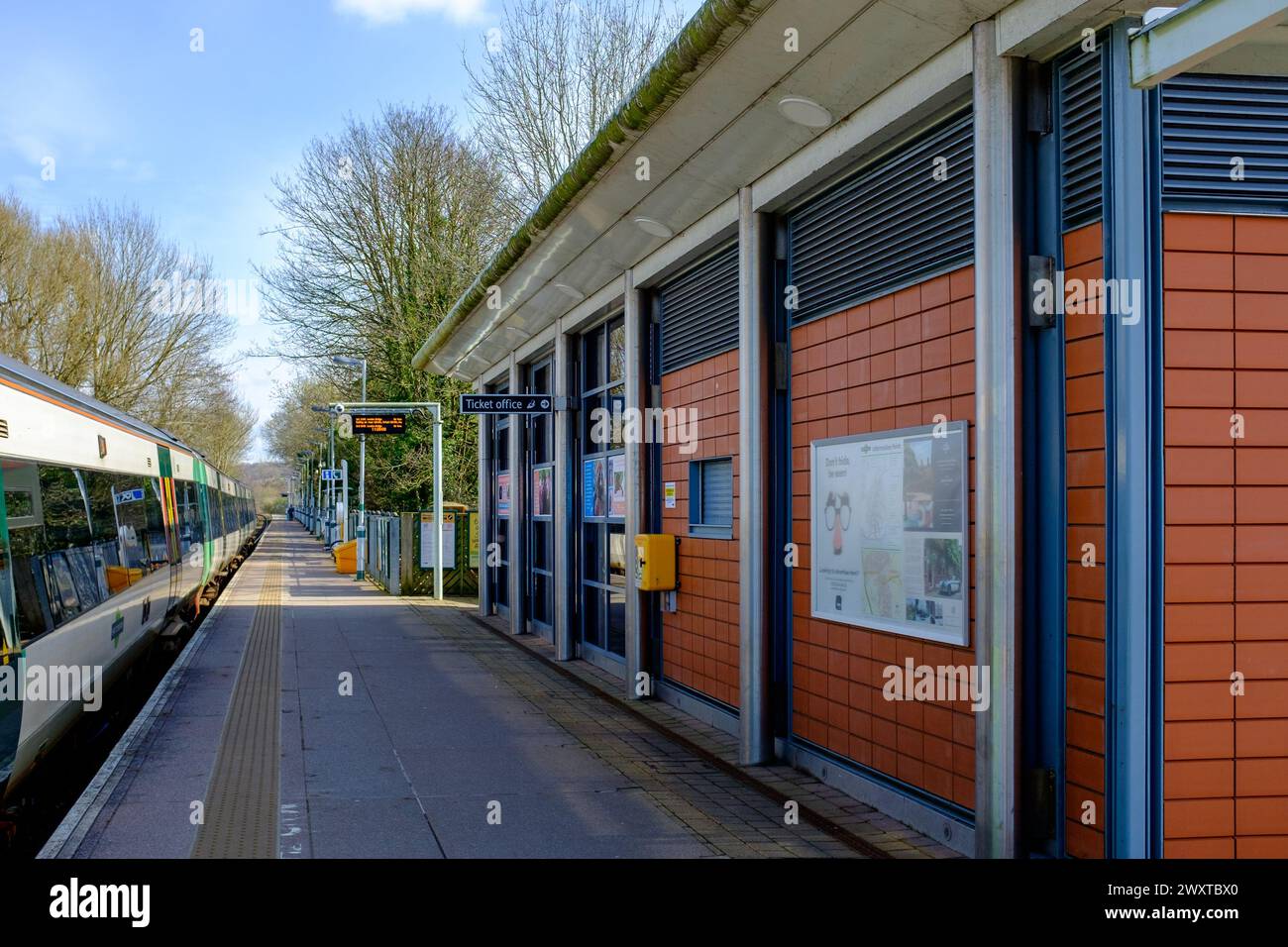 A Southern Railway train in green and yellow livery stands at almost ...