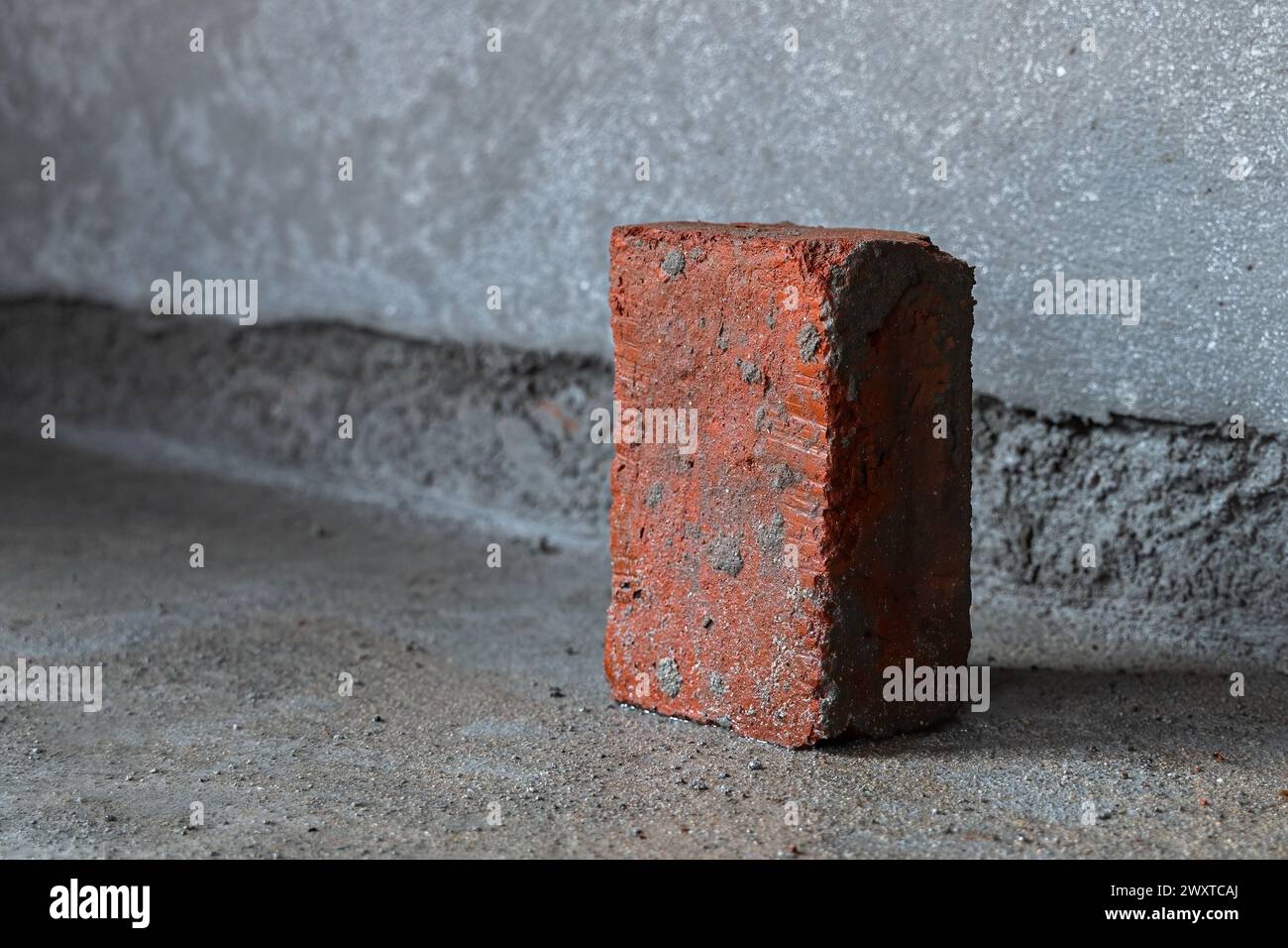 Brick made of soil placed vertically on concrete floor at construction ...
