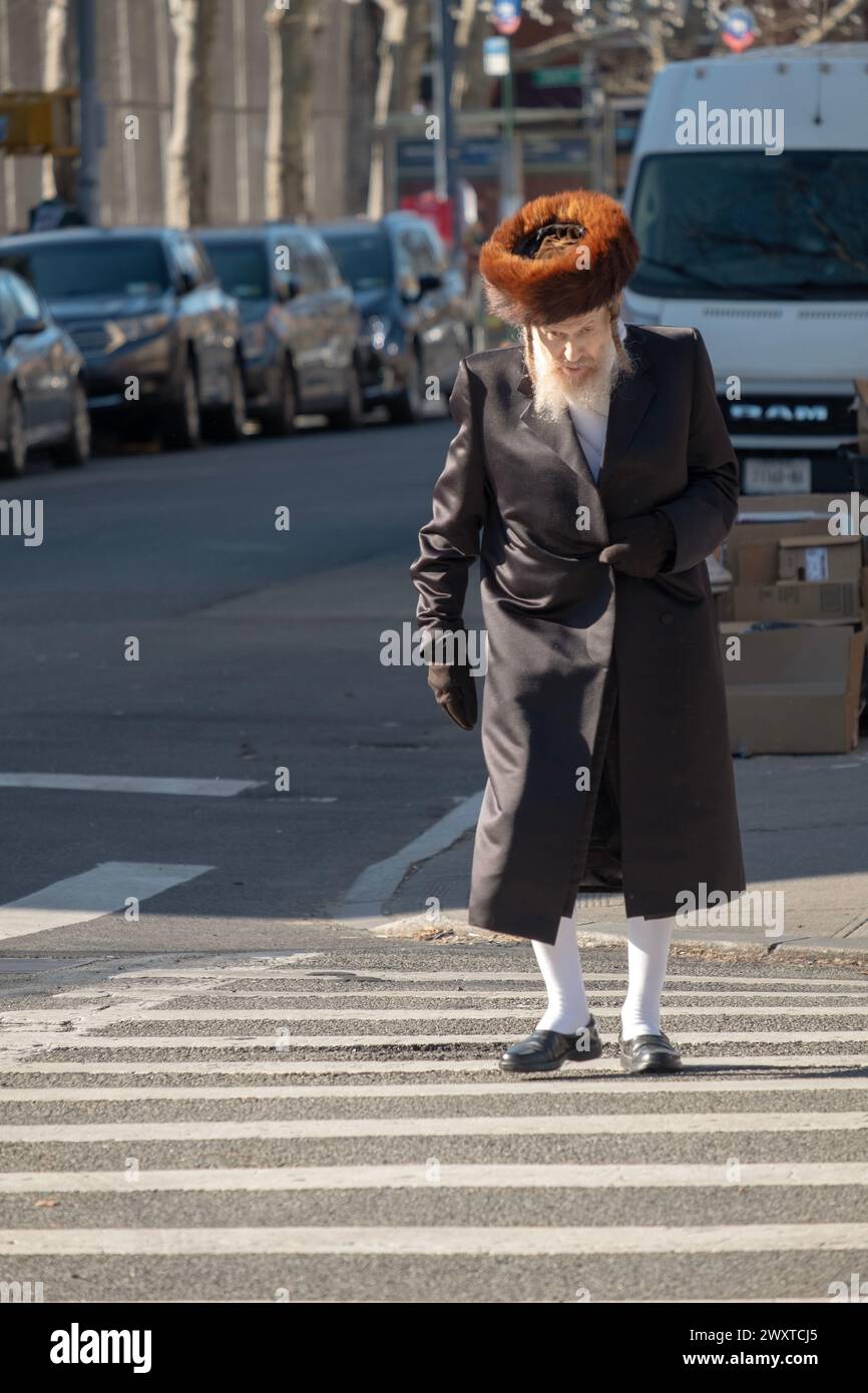 An older Hasidic Jewish man wearing high white stockings and a ...