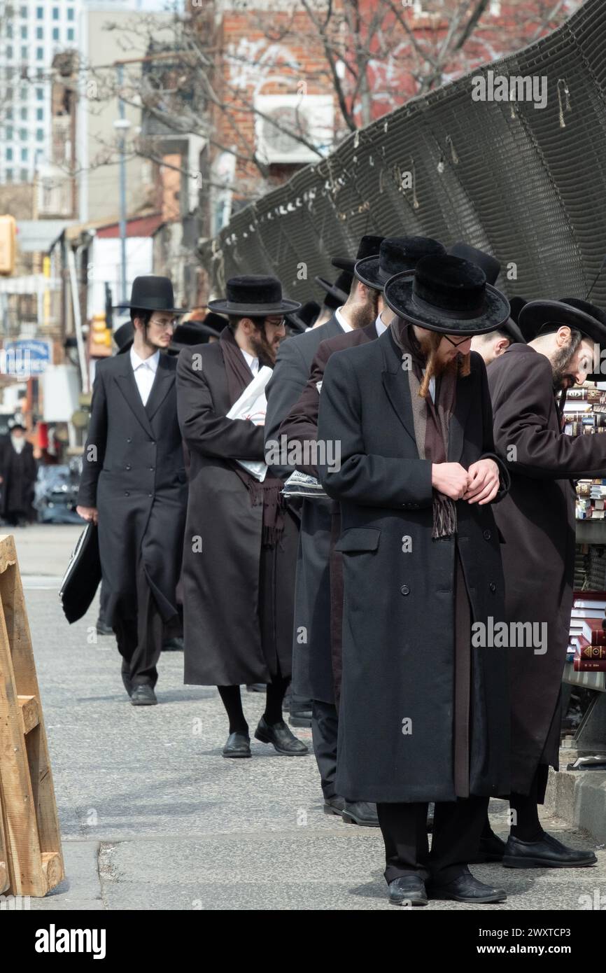 On a warm early spring day orthodox Jewish men shop at a pop up store ...