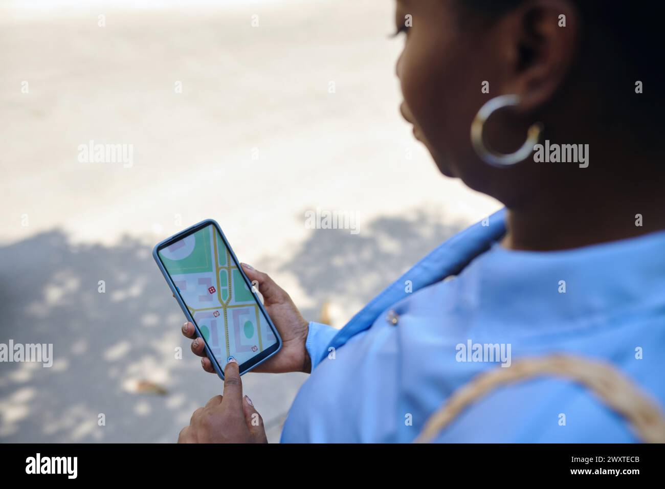 Woman tracking taxi car on map via mobile application Stock Photo - Alamy