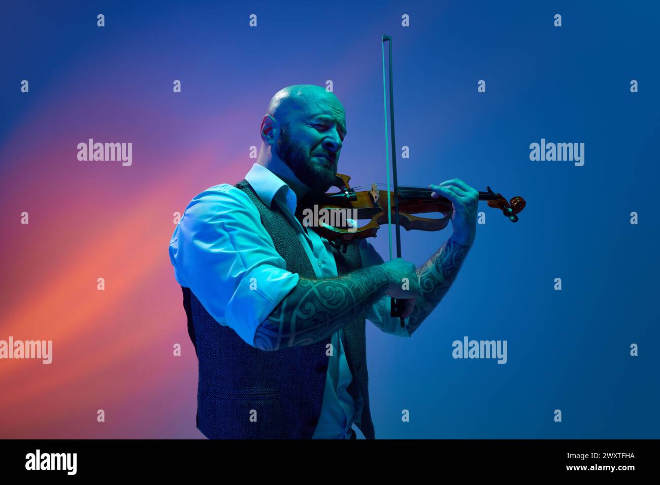 Young bald man playing classical hi-res stock photography and images ...